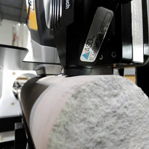 The ASD TerraSpec 4 making a measurement on a rock core in the Geotek ...